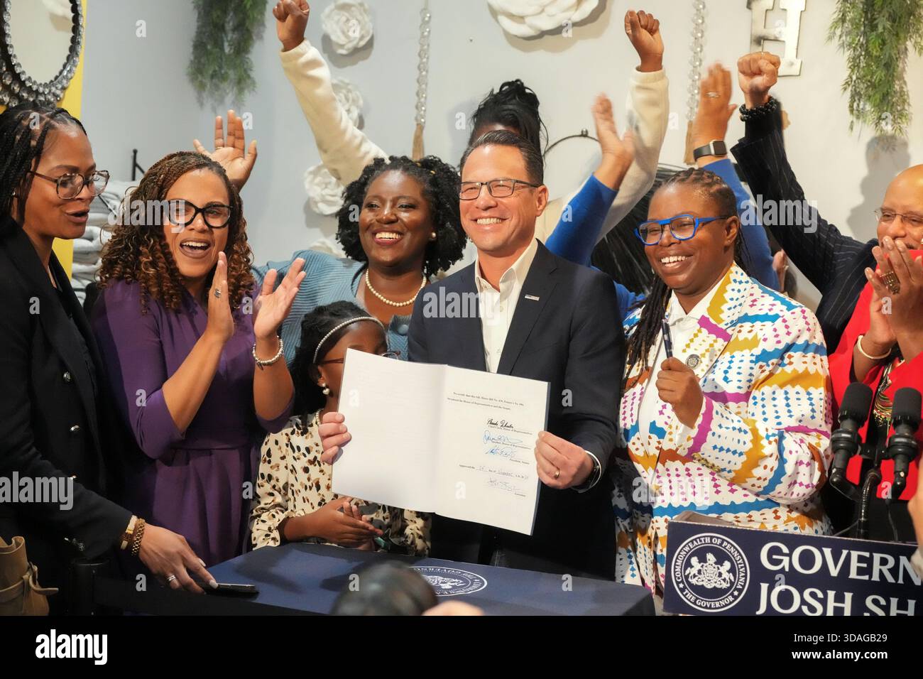 Speaker Joanna McClinton, back center left, Governor Josh Shapiro ...