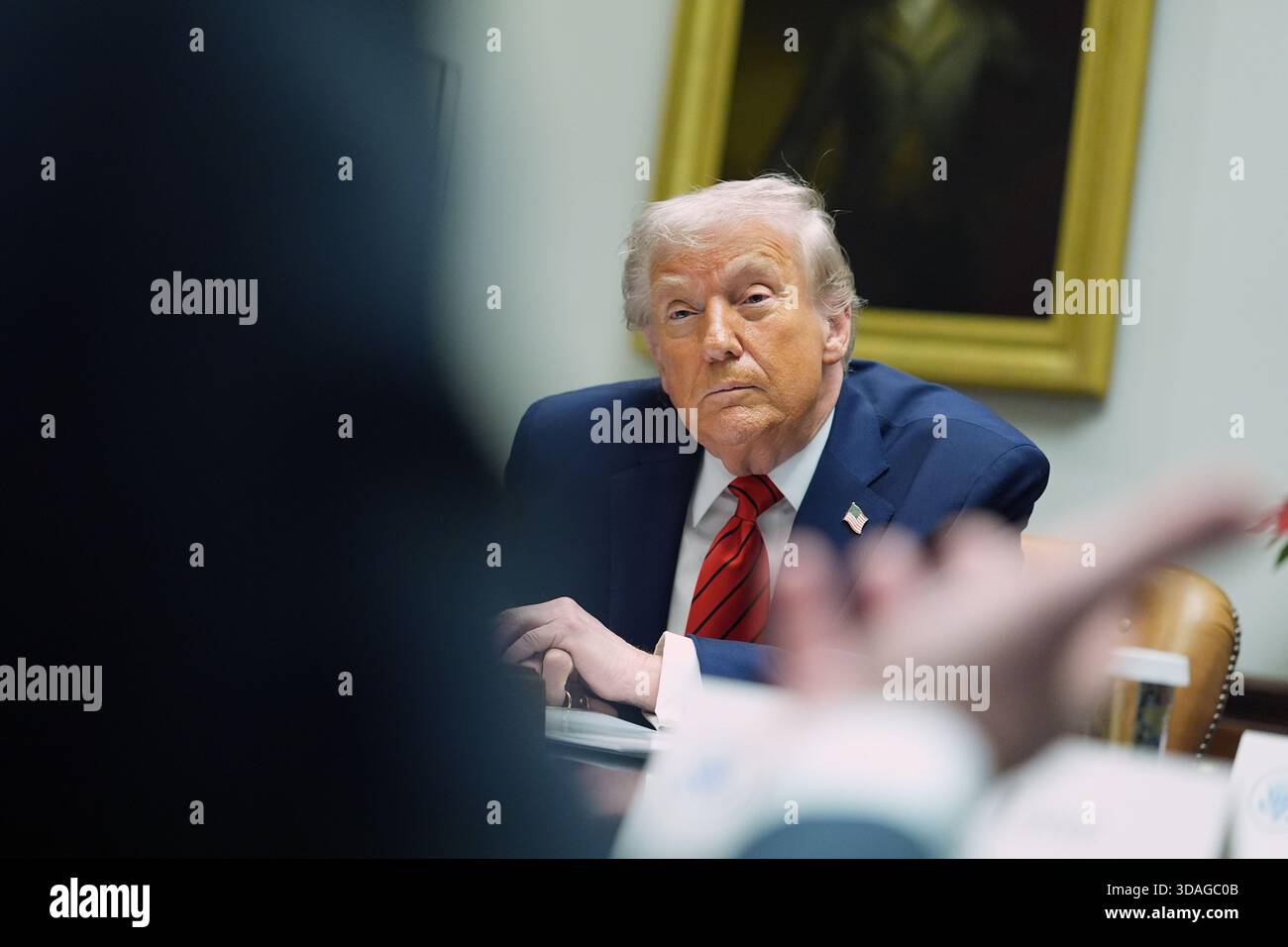President Donald Trump listens during a roundtable discussion with ...
