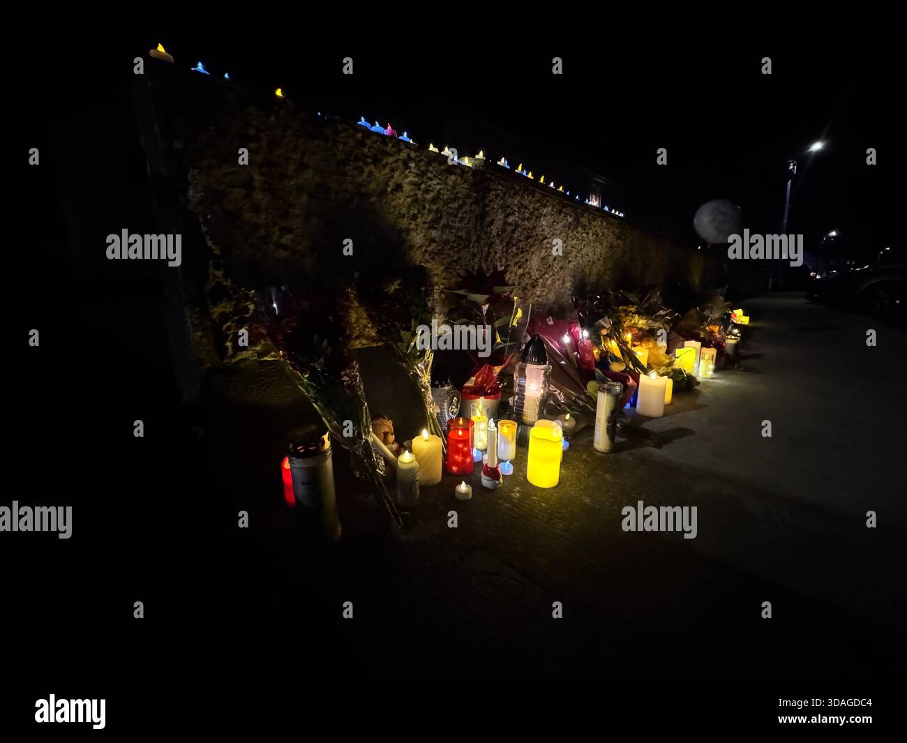 Candle and flowers left outside a property at Castleview Park, where ...