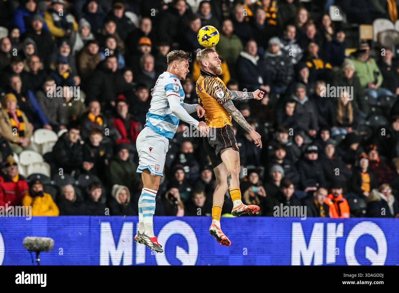 Oliver McBurnie of Hull City jumps up to win the high ball during the ...