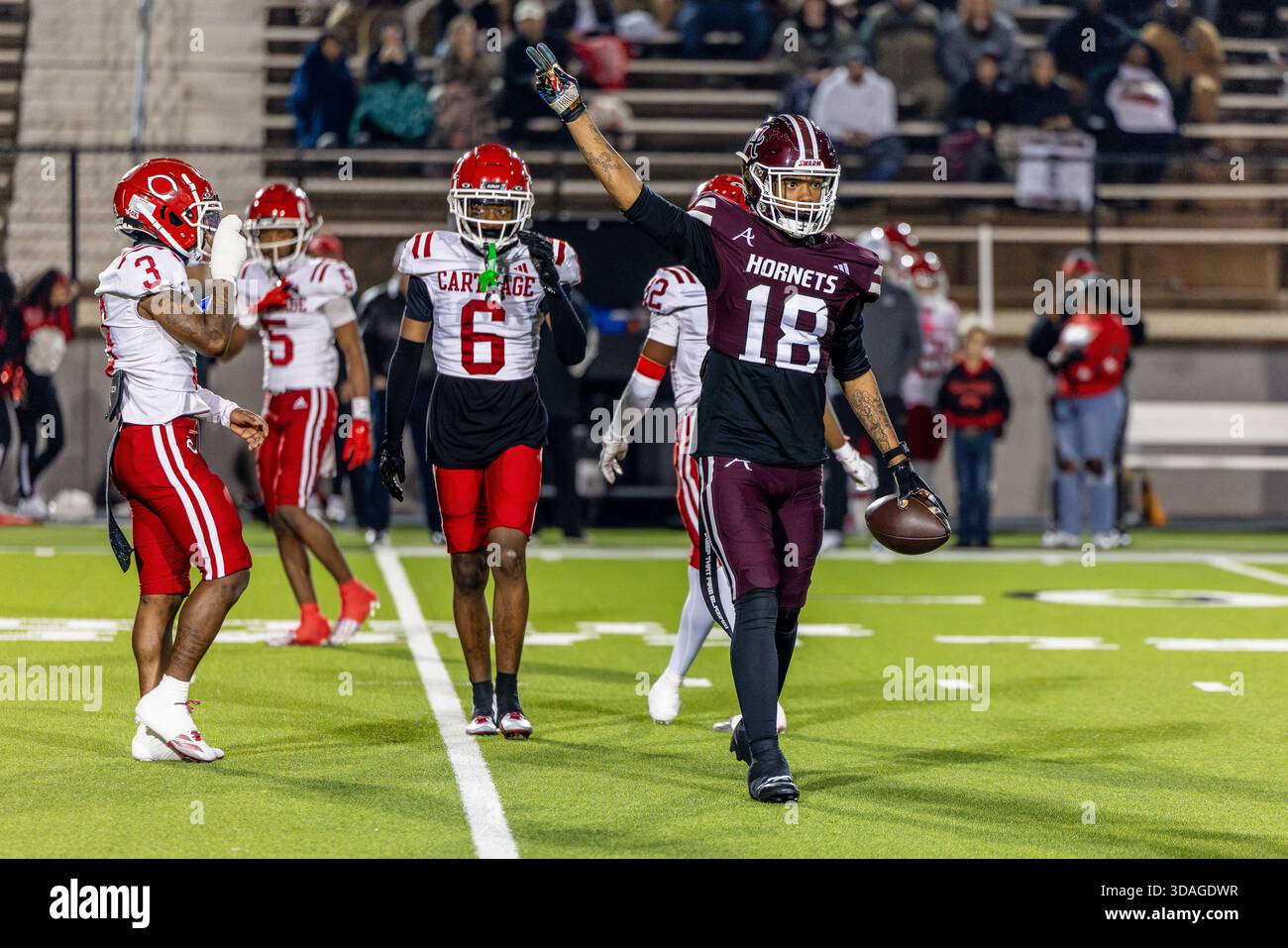 Tyler, TX USA: Athens Hornets wide receiver Emanuel Moore (18) signals ...