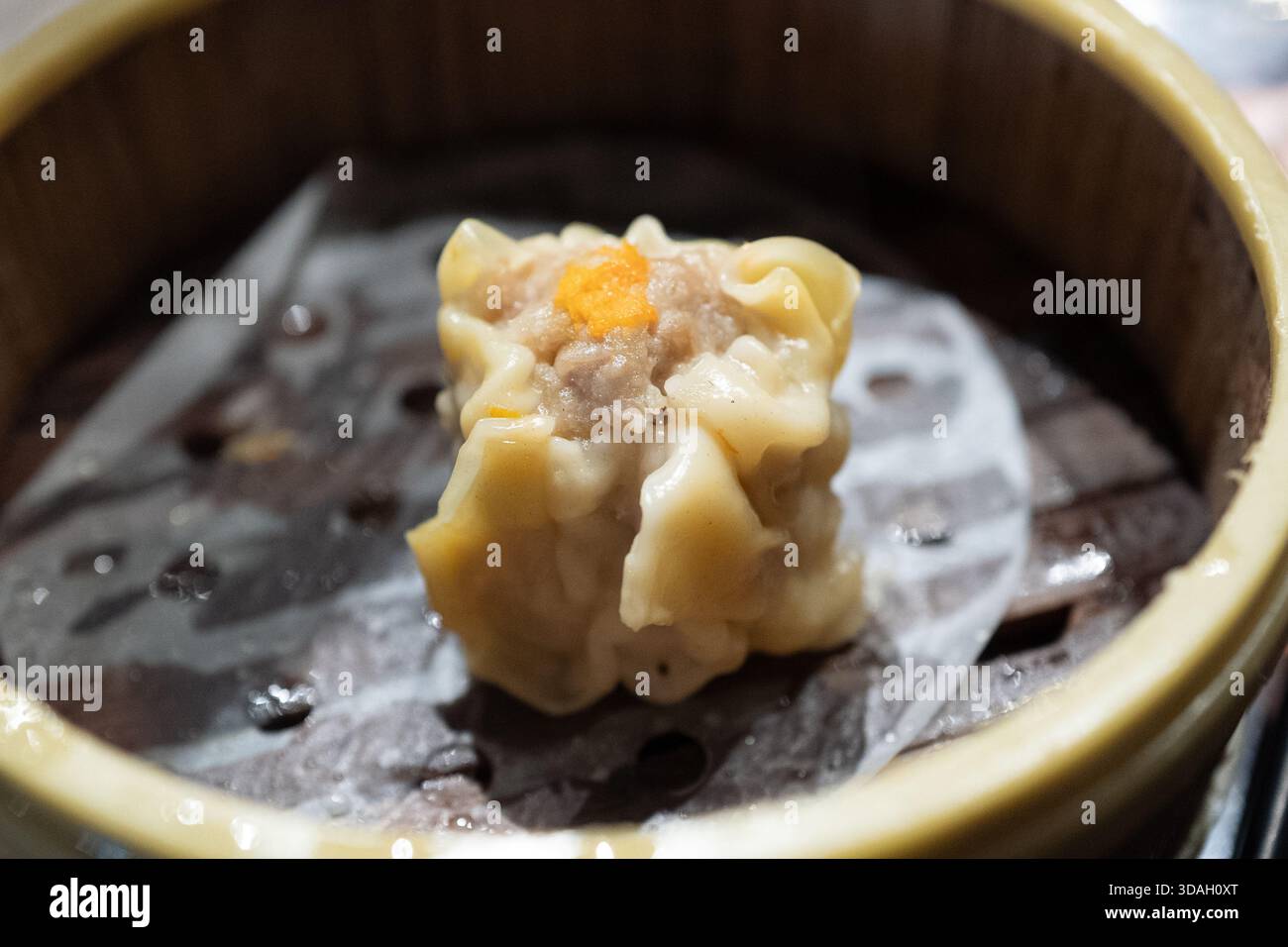 Siu mai (shumai) dumpling in a steamer at a Dim Sum restaurant in ...