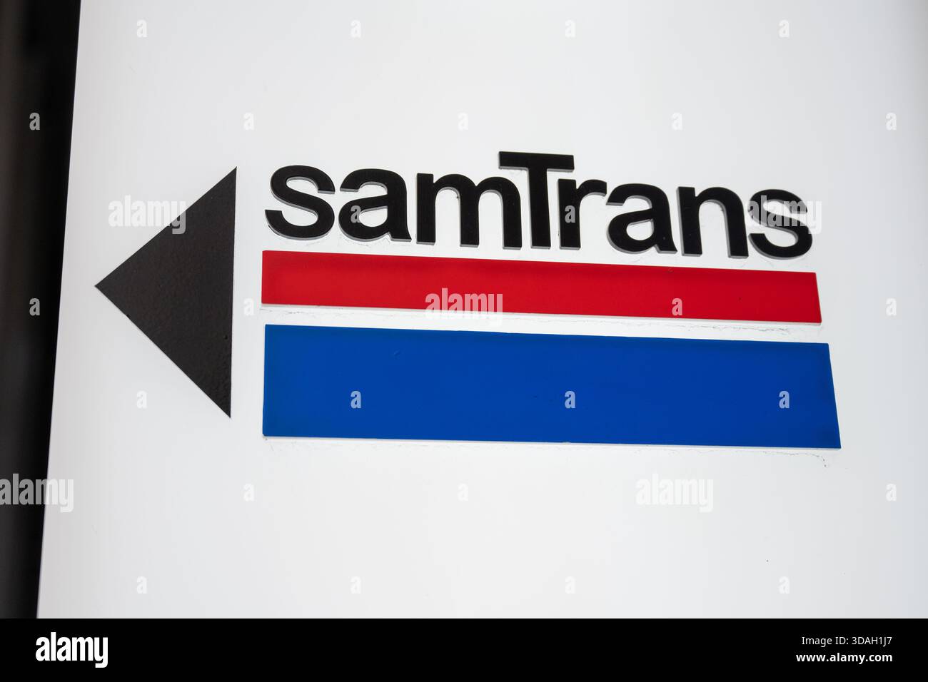 SamTrans public transit directional sign with arrow and red and blue ...