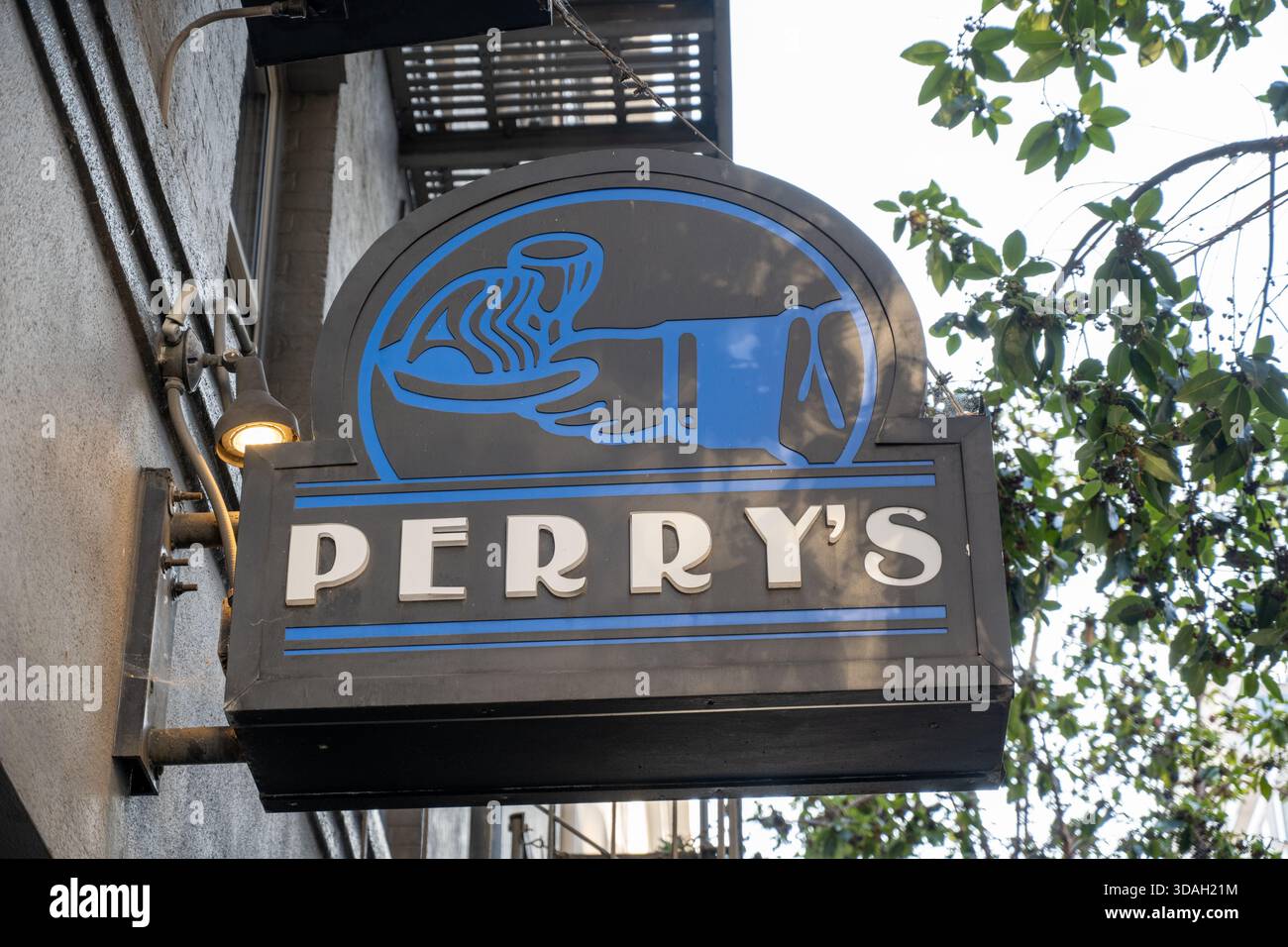 Hanging Perry S Restaurant Sign With Blue Server Logo On Exterior Wall
