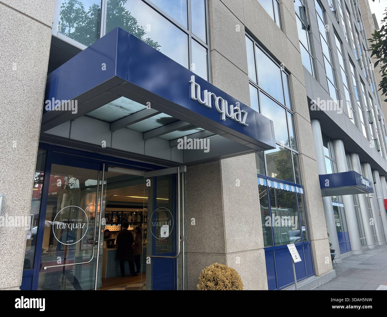 Facade of Turquaz with blue signage and glass entrance on Mission ...