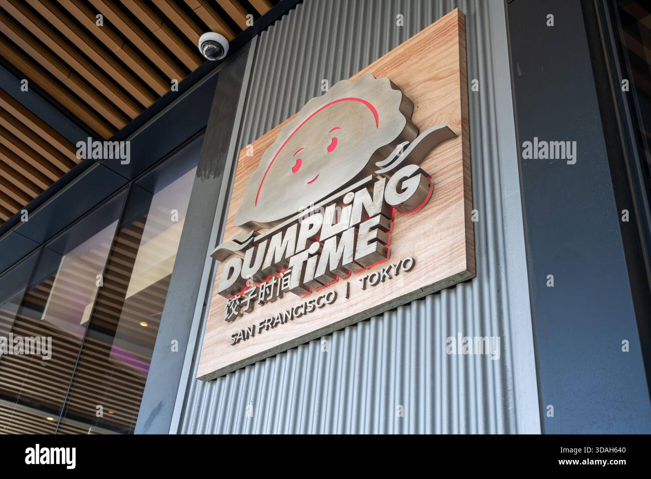 Restaurant logo sign for Dumpling Time on corrugated metal facade, San ...