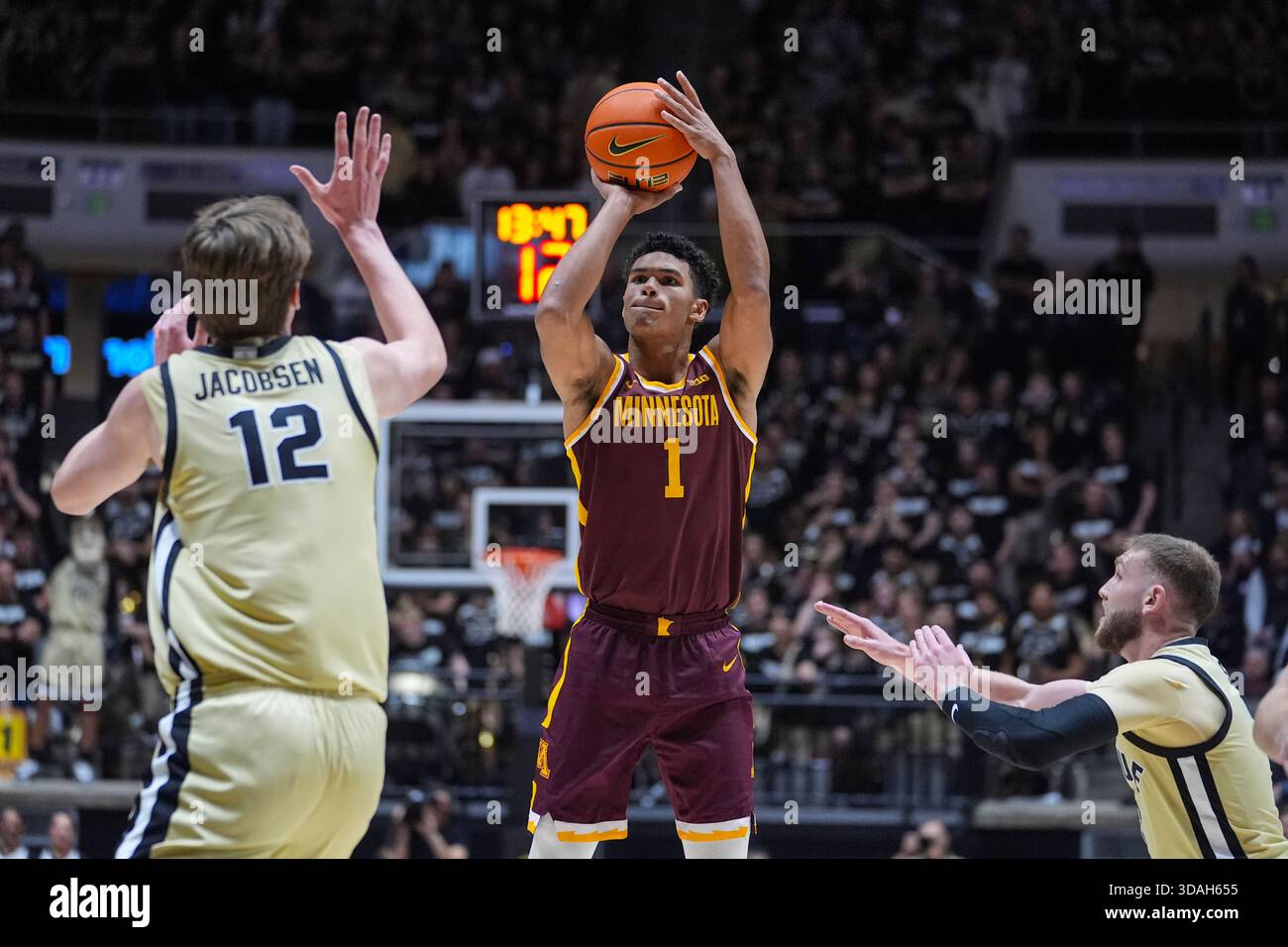 Minnesota guard Isaac Asuma (1) shoots over Purdue center Daniel ...