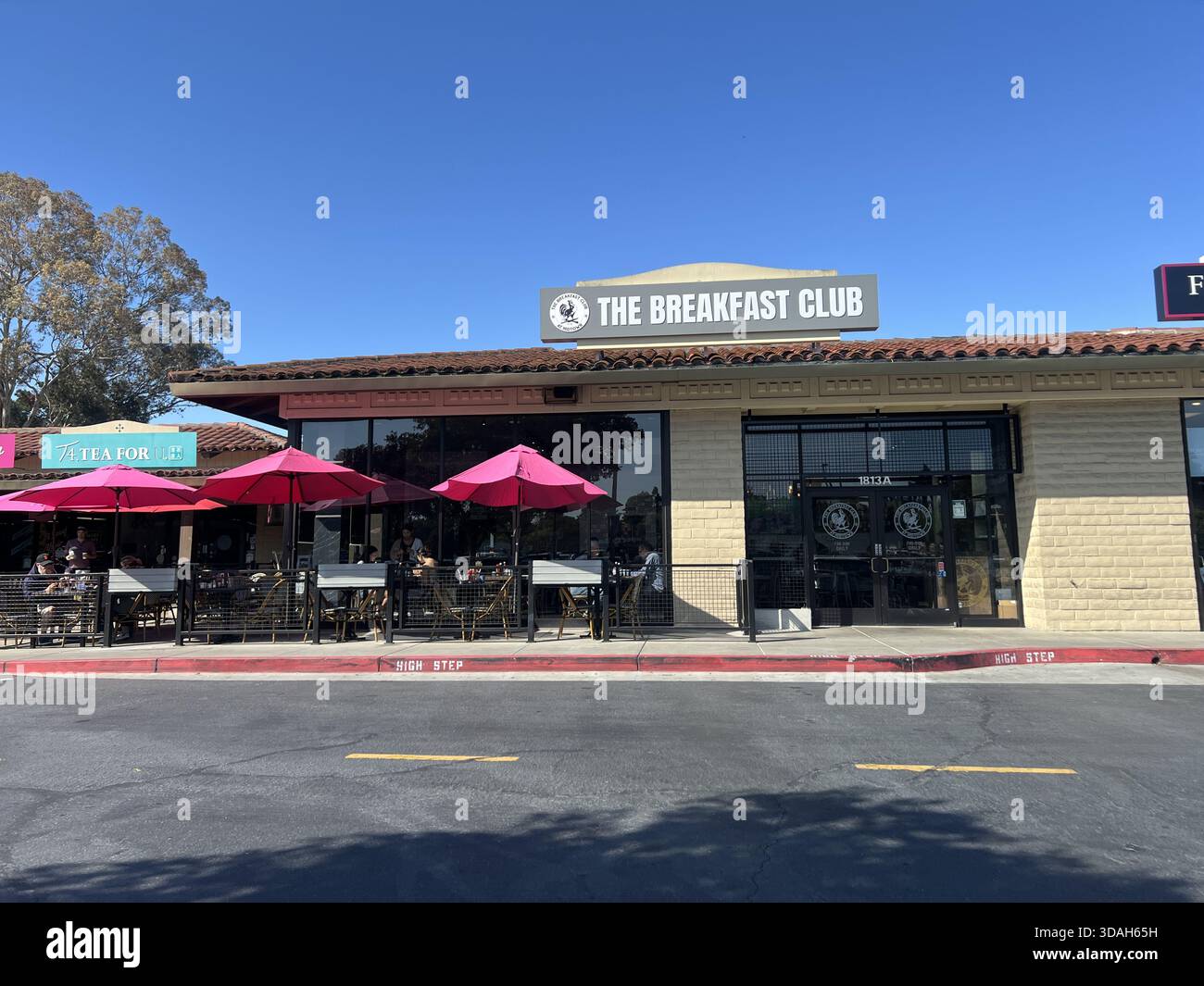 Facade of The Breakfast Club restaurant with bright pink patio ...