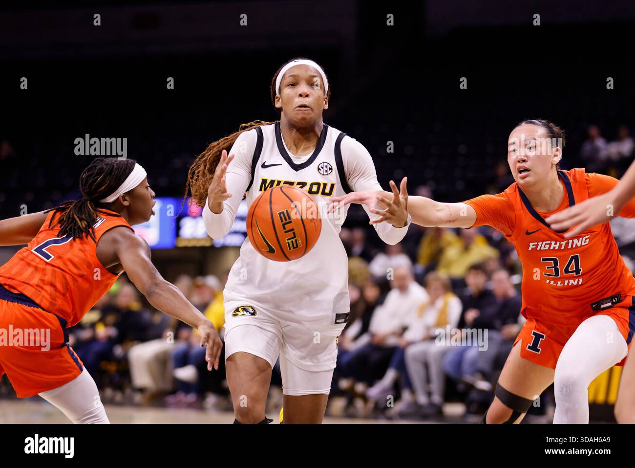 Missouri guard Jayla Smith, center loses the ball as Illinois guards ...