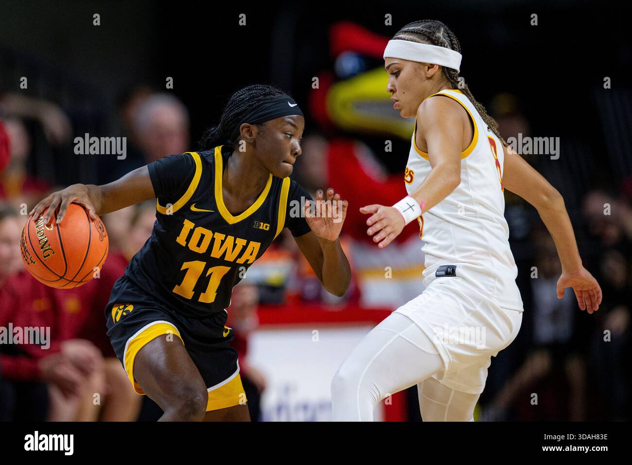 Iowa guard Chazadi Wright (11) dribbles as Iowa State guard Jada ...