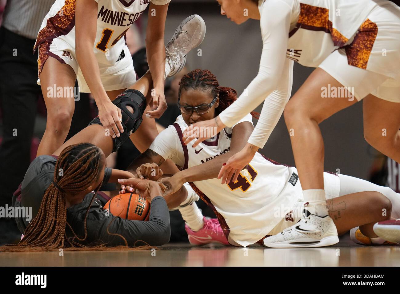 Alabama A&M center Jaida Belton (5), left, and Minnesota forward Niamya ...