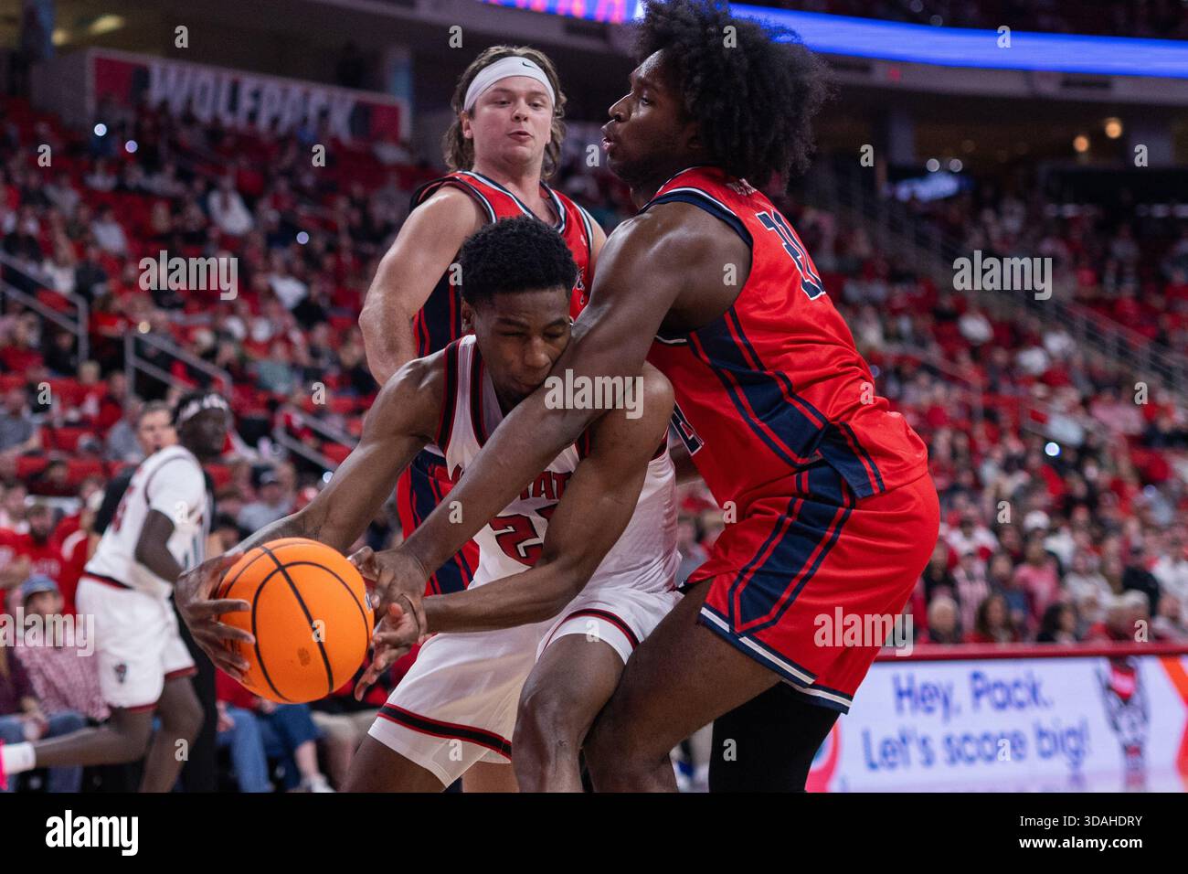 December 10, 2025: Liberty Flames forward Ryan Jones Jr. (21) fouls NC ...