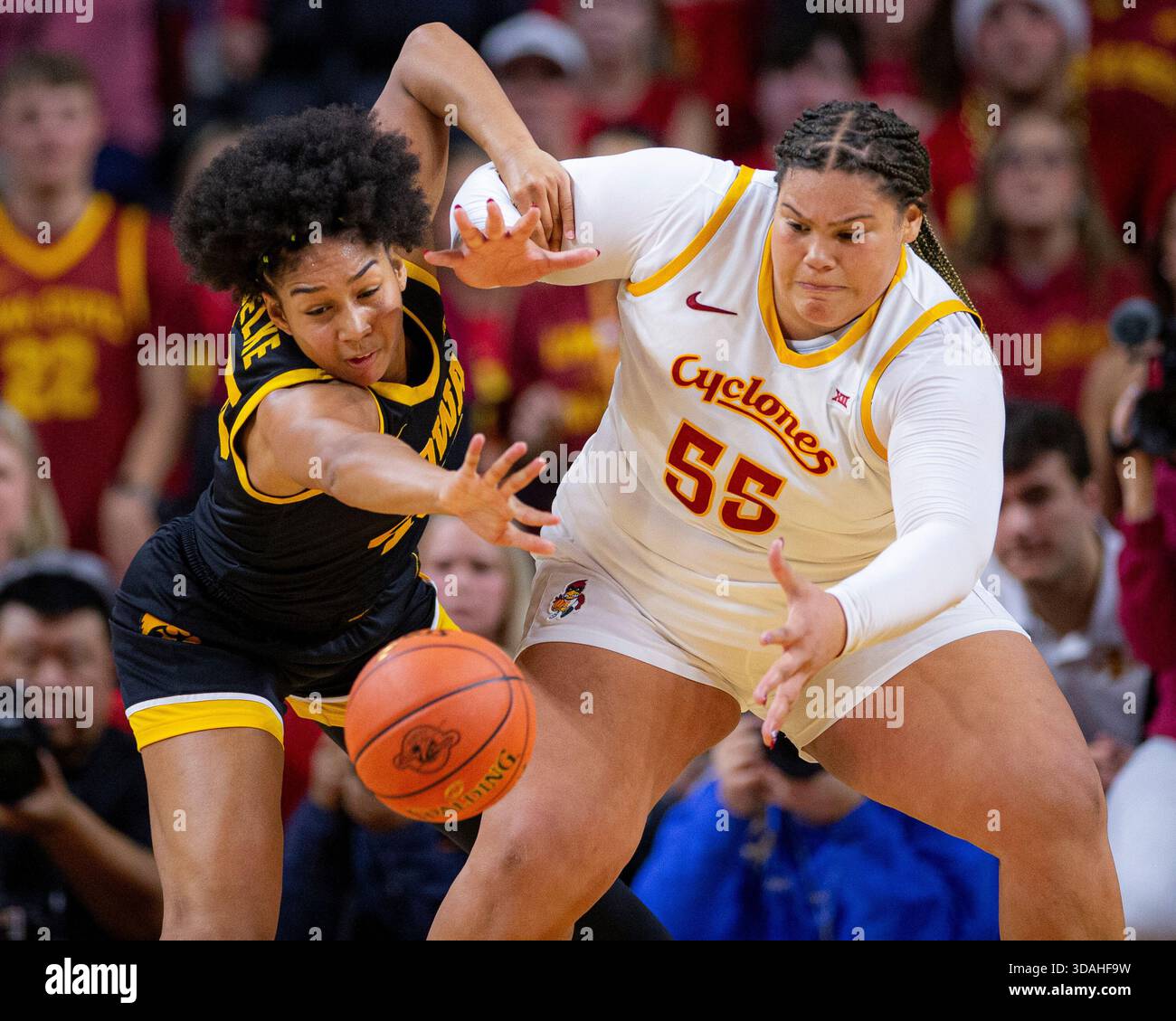 Iowa forward Hannah Stuelke, left and Iowa State center Audi Crooks (55 ...