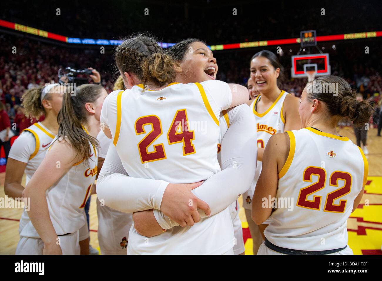Iowa State Cyclones center Audi Crooks, center, hugs forward Addy Brown (24) after an NCAA ...