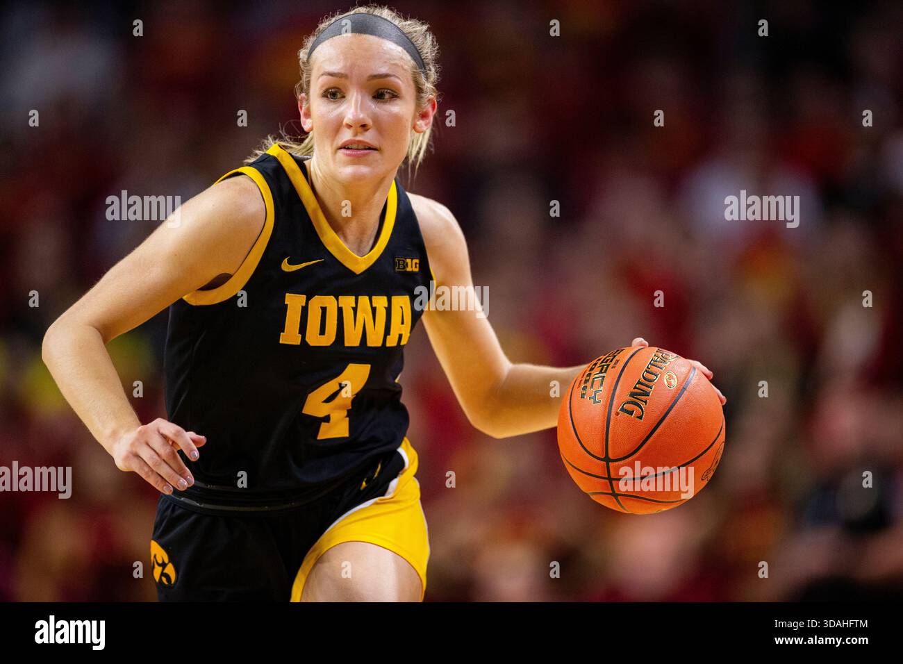 Iowa guard Kylie Feuerbach (4) dribbles during a NCAA college ...