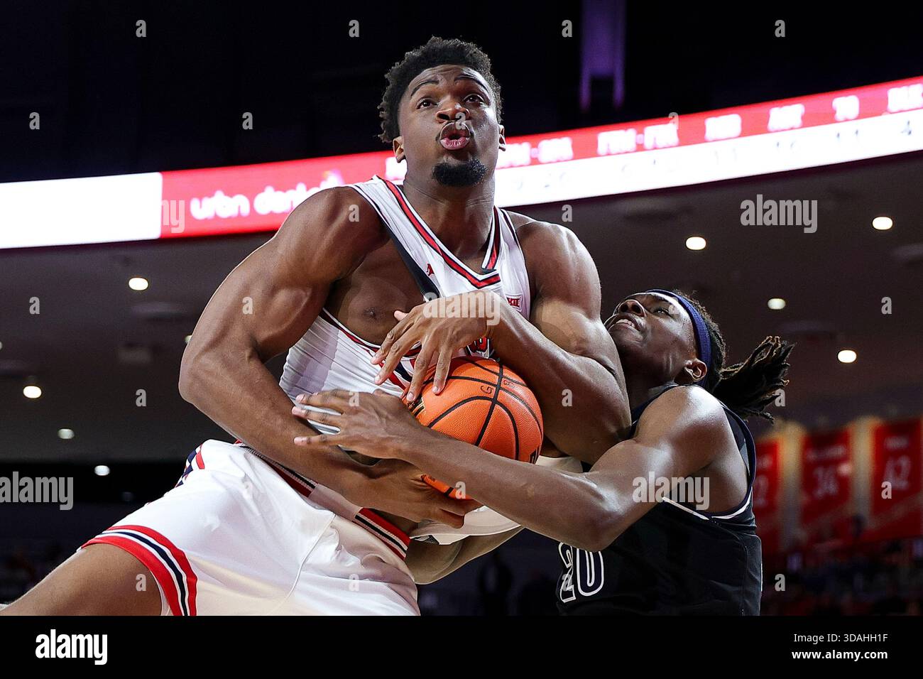 Houston Cougars center Cedric Lath (8) and Jackson State Tigers forward ...