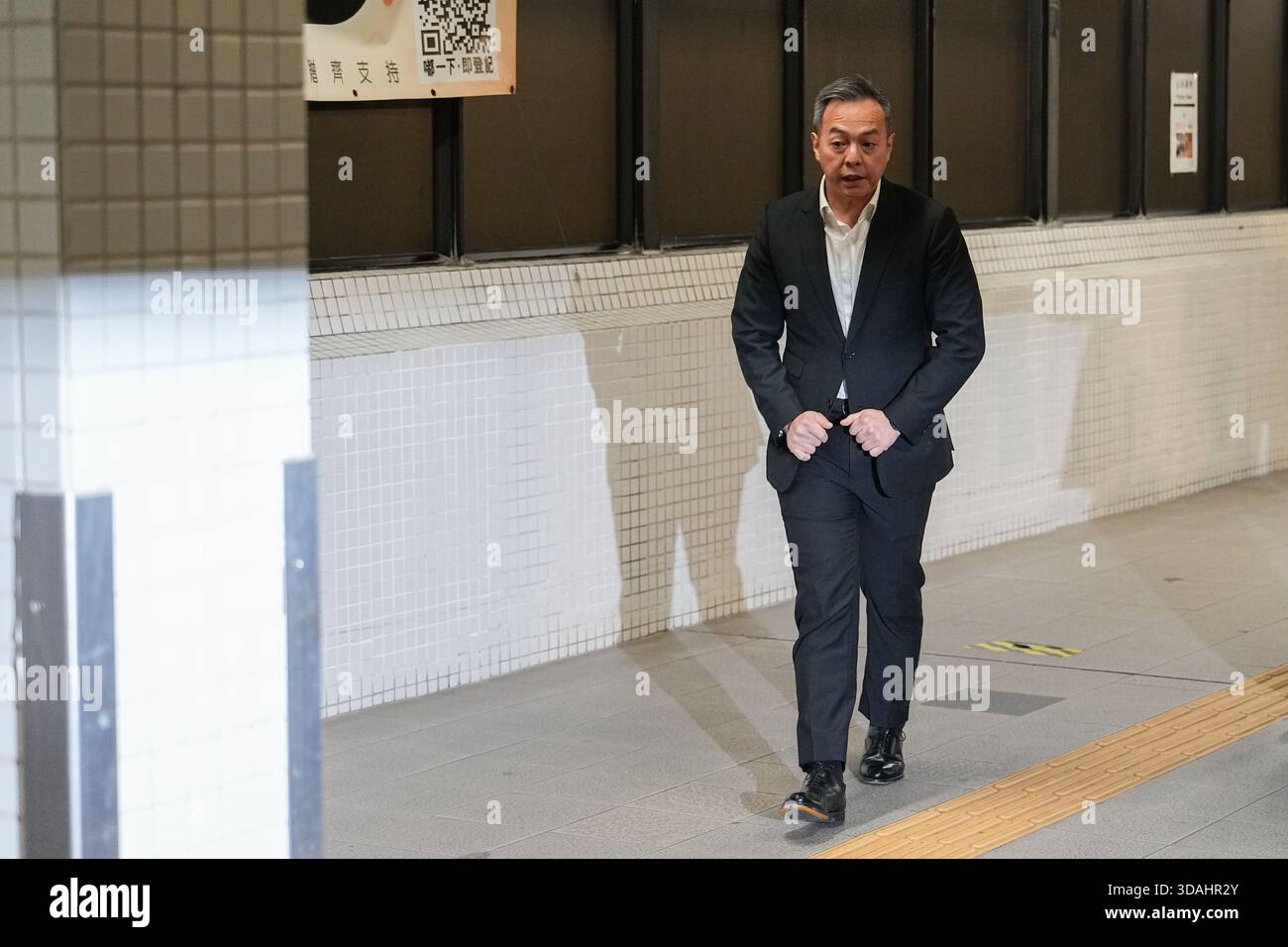 Joe Chow Yat-ming, Commissioner of Police, walking to the press stand-up area on December 10 ...
