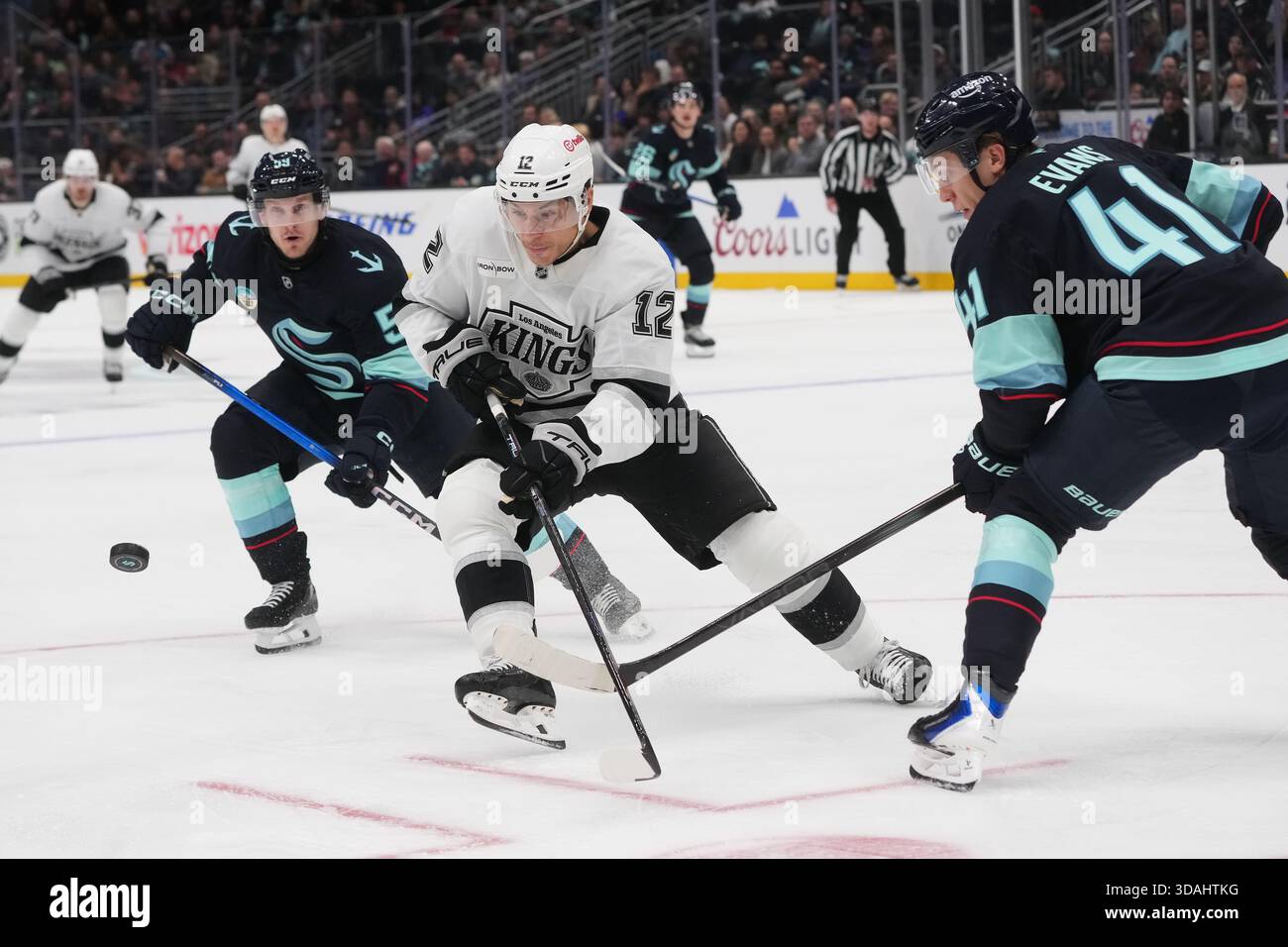 Los Angeles Kings left wing Trevor Moore (12) follows the puck against ...