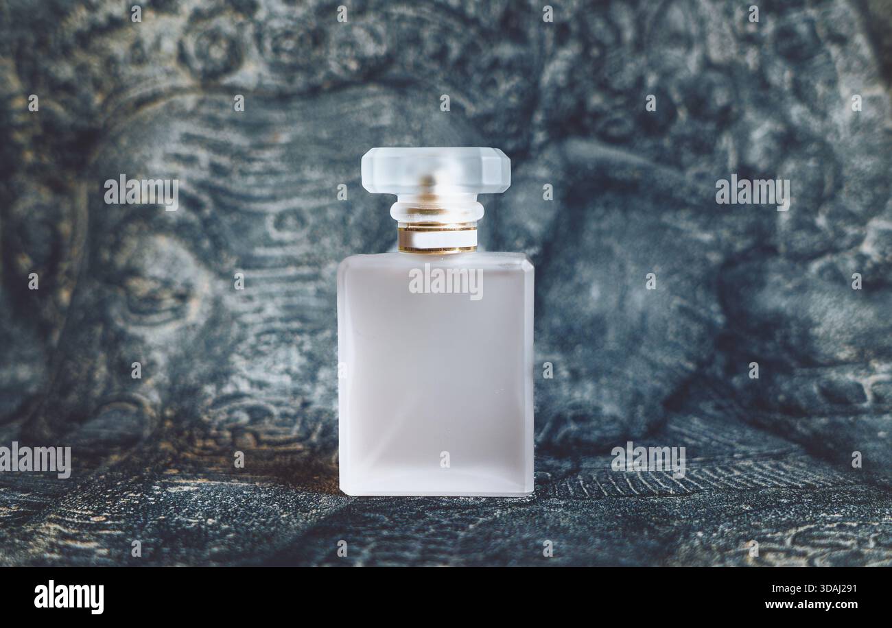 Premium matte-white fragrance bottle showcased in a soft, airy beauty ...