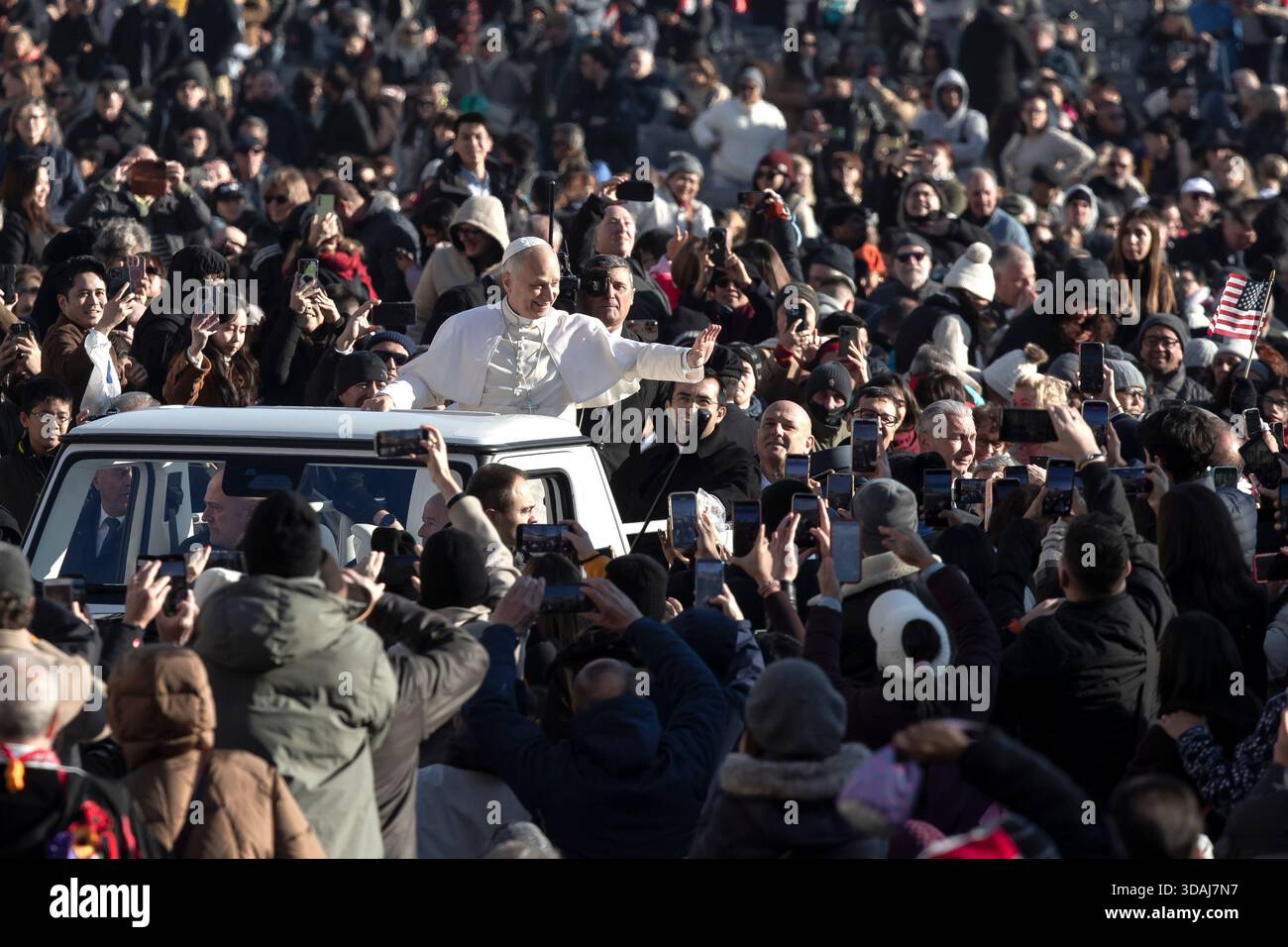 Pope Leo XIV waves as he arrives for his weekly general audience in St ...