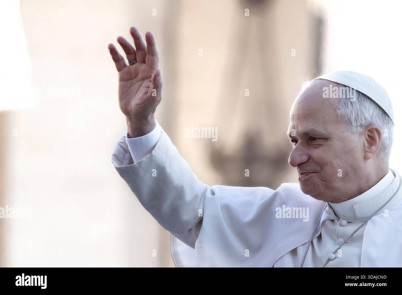 Pope Leo XIV waves as he arrives for his weekly general audience in St ...