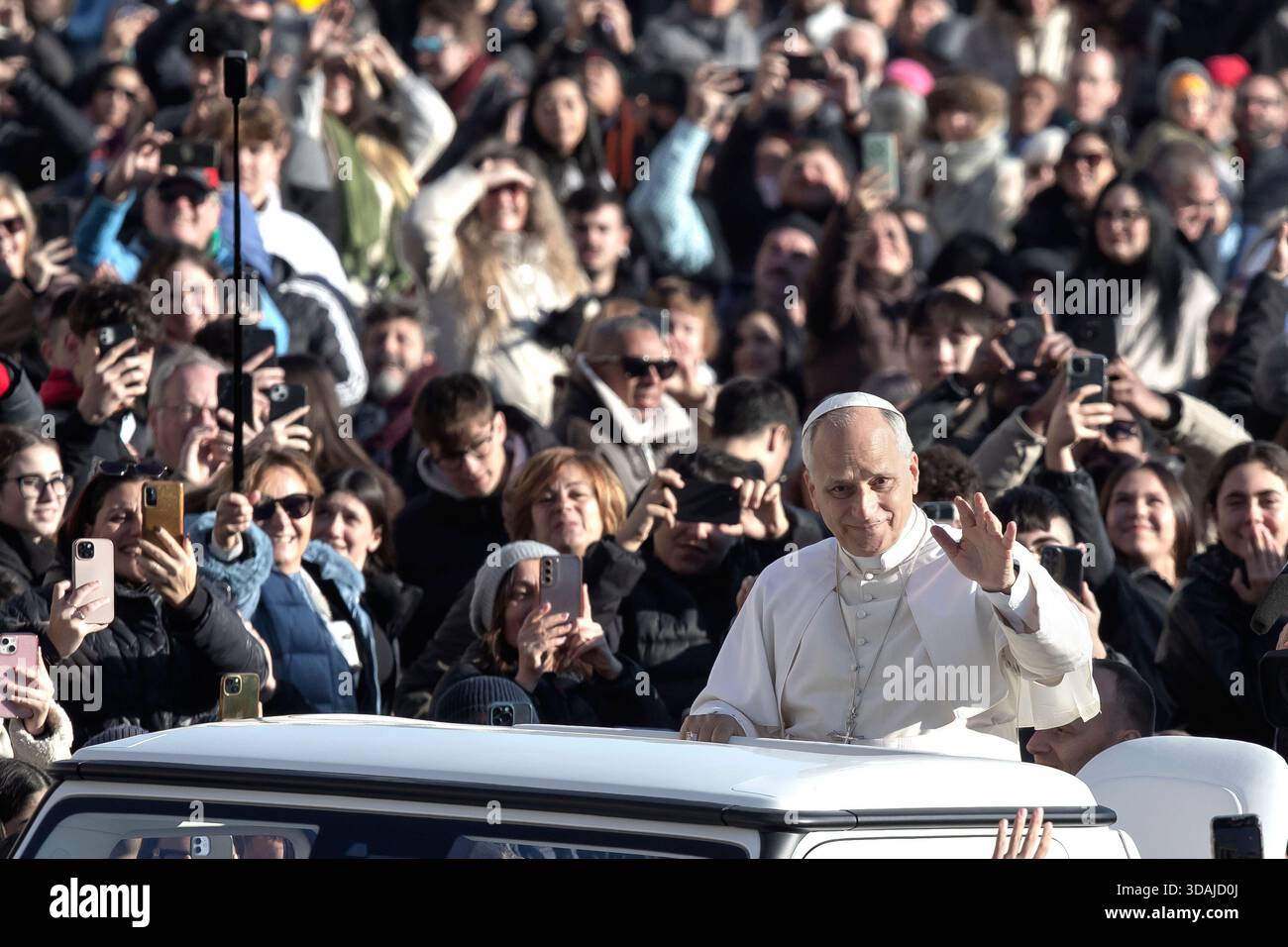 Pope Leo XIV waves as he arrives for his weekly general audience in St ...