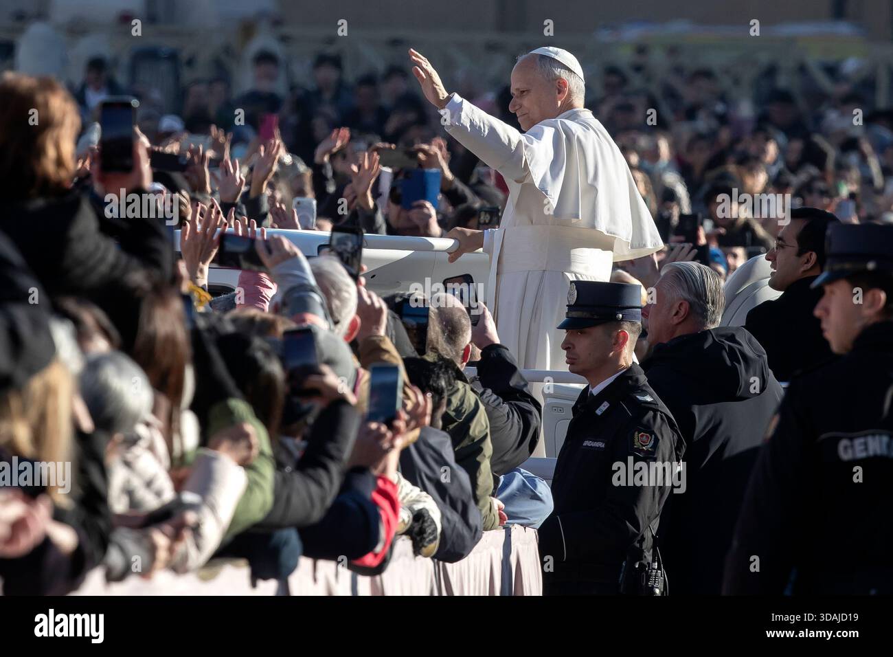 Pope Leo XIV waves as he arrives for his weekly general audience in St ...