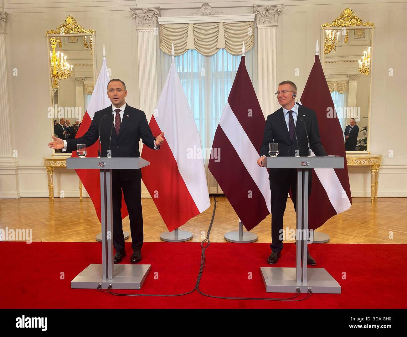 11 December 2025, Latvia, Riga: Latvian President Edgars Rinkevics (r ...