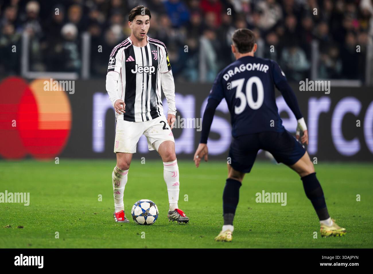 Fabio Miretti of Juventus FC is challenged by Vlad Dragomir of Pafos FC ...