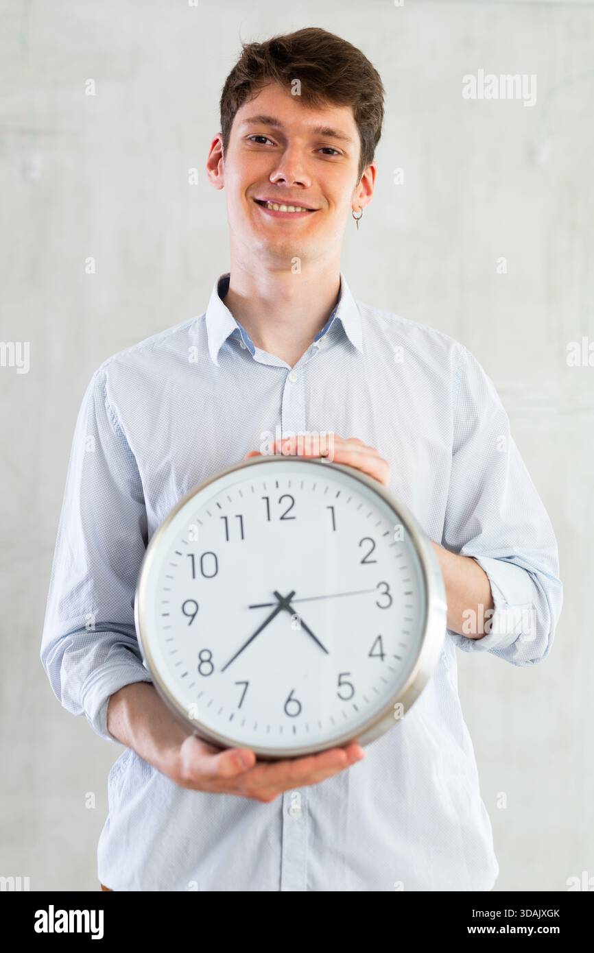 Young guy posing clock hi-res stock photography and images - Alamy