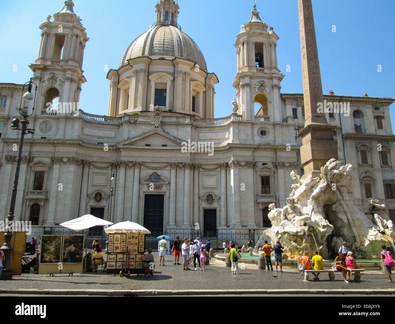 Visitors stroll through Piazza Navona in Rome, Italy, a lively historic ...
