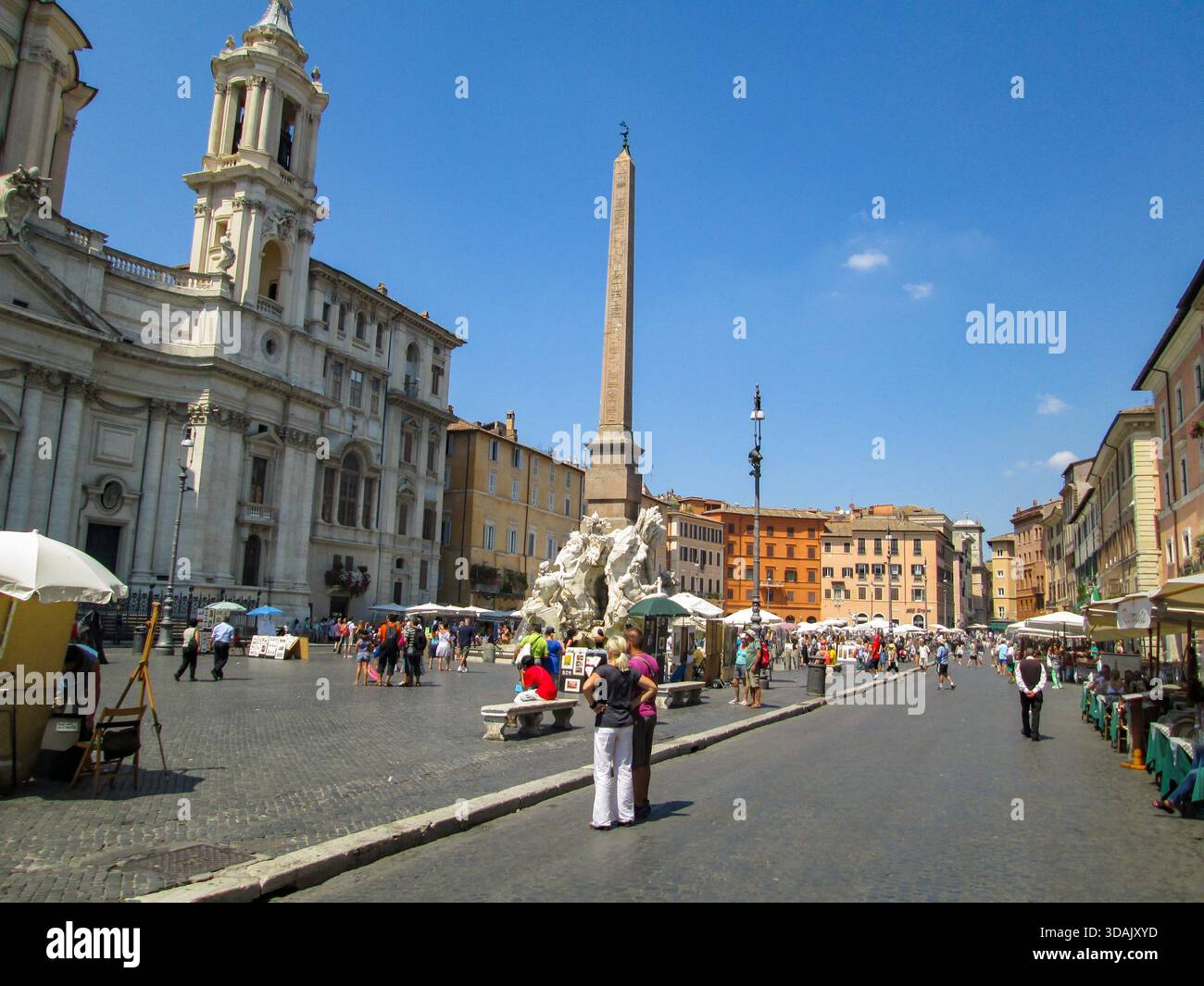 Visitors stroll through Piazza Navona in Rome, Italy, a lively historic ...