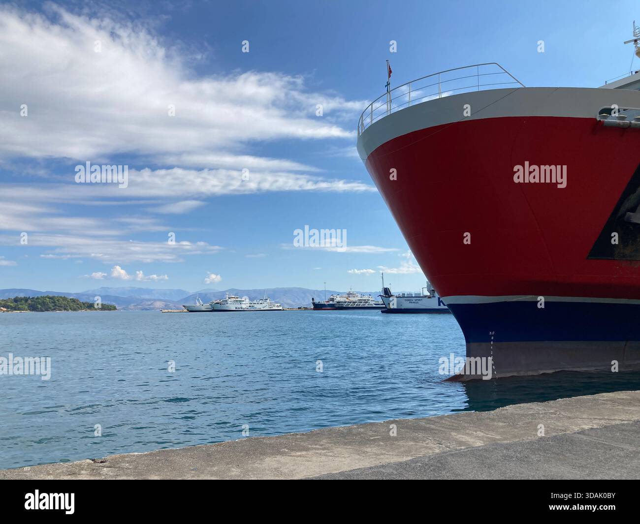 Harbour docks with moored boats and waterfront piers in Corfu, Greece ...