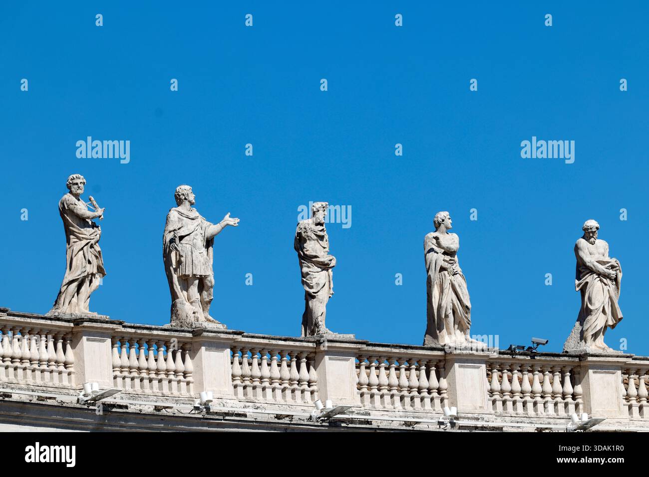 St. Peter’s Basilica. Colossal saints watch the piazza, sculpted robes ...