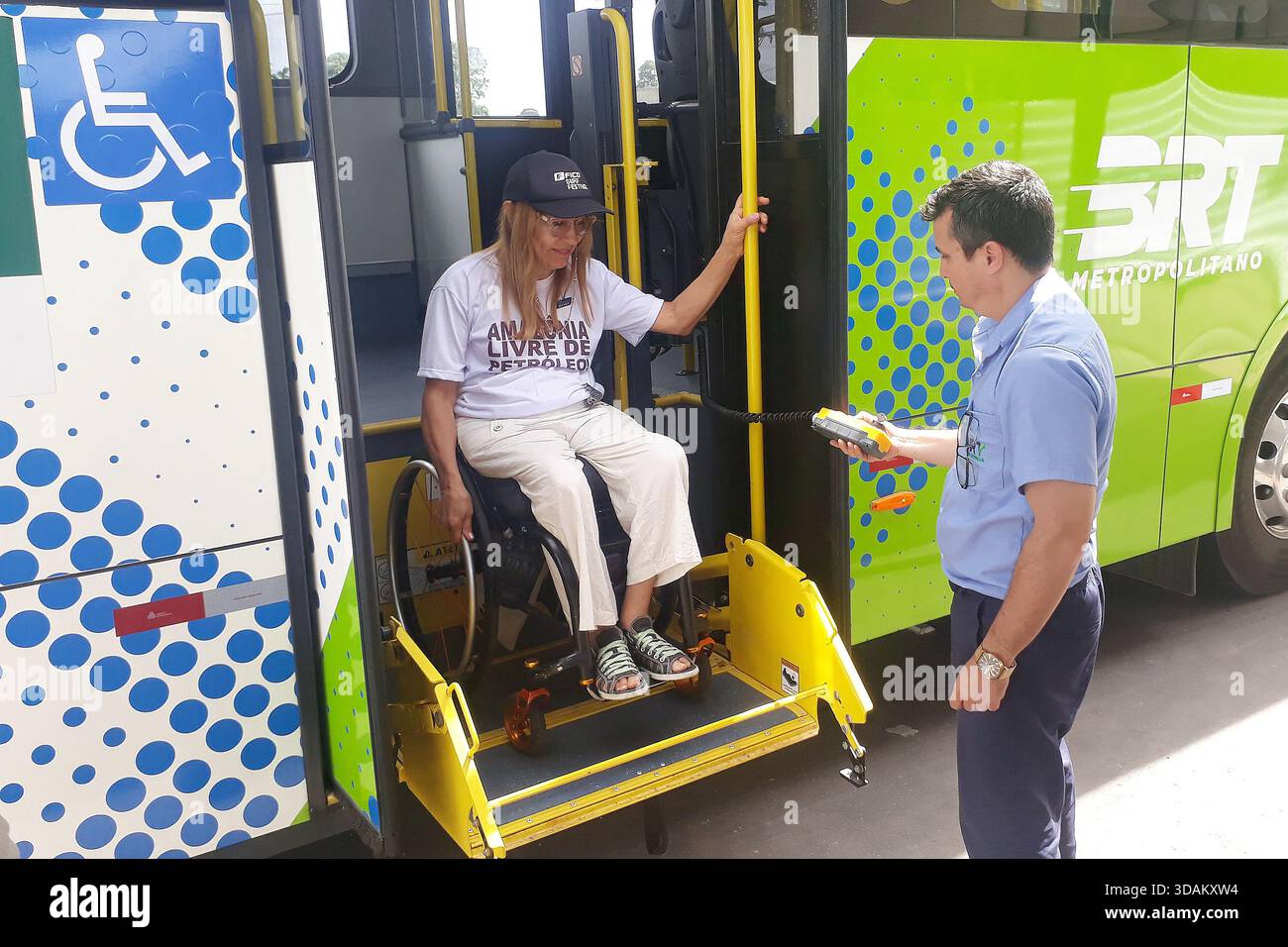 Belém, Brazil, November 20, 2025. Wheelchair user using the access ramp ...