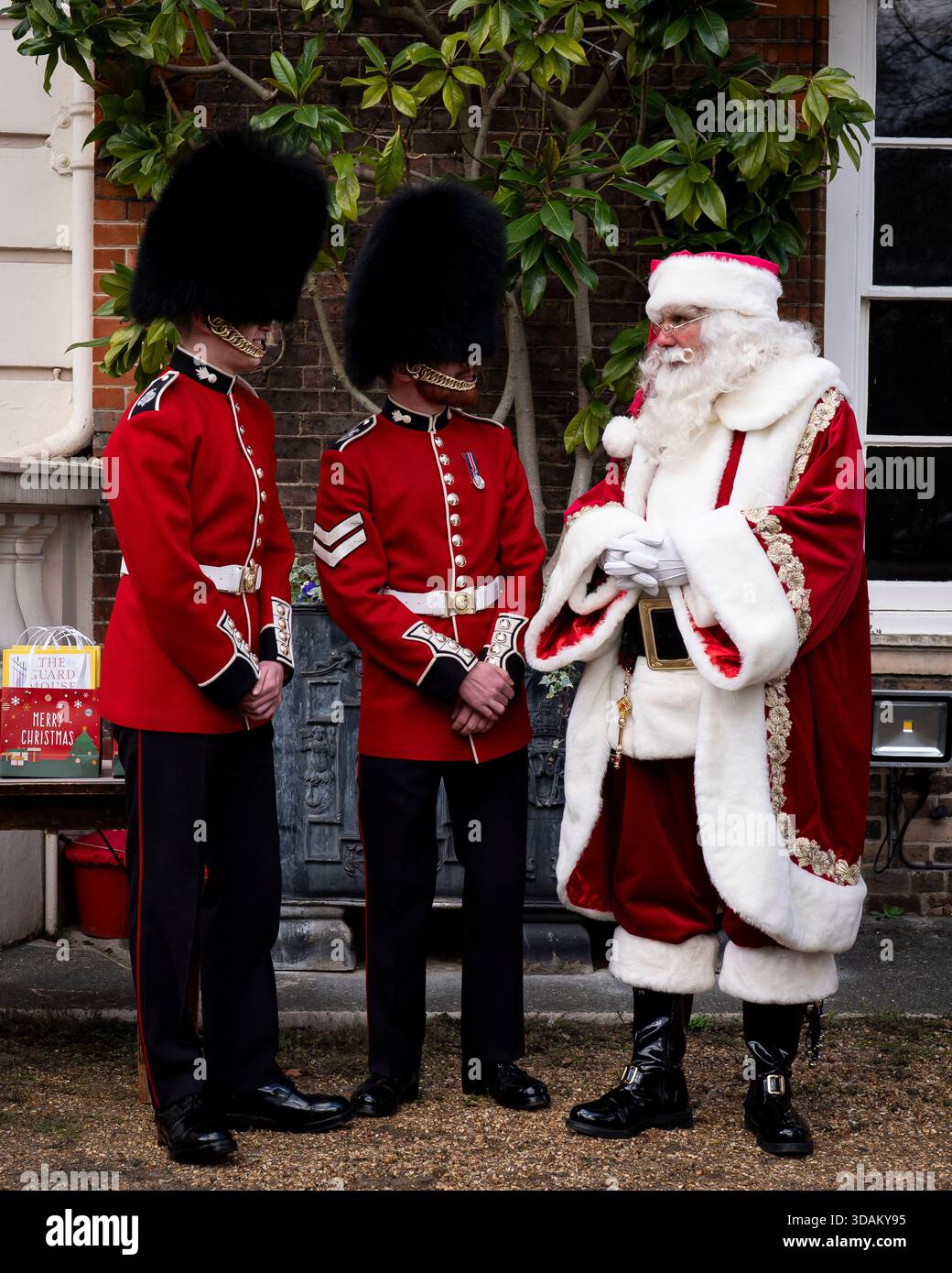 A person dressed as Father Christmas meets members of the Coldstream ...