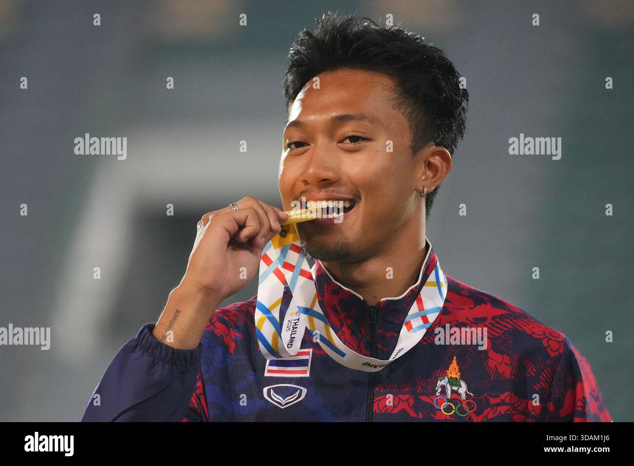 Thailand's Puripol Boonson pose with gold medal during medal ceremony for men's 100m final at ...