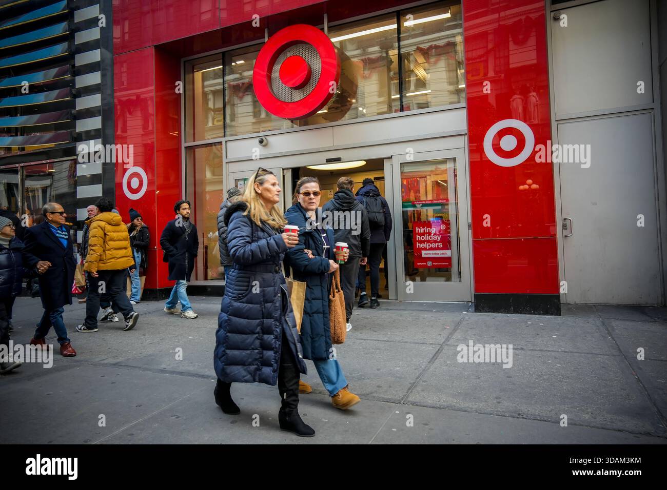 Shoppers in Herald Square in New York pass the Target store on Saturday ...