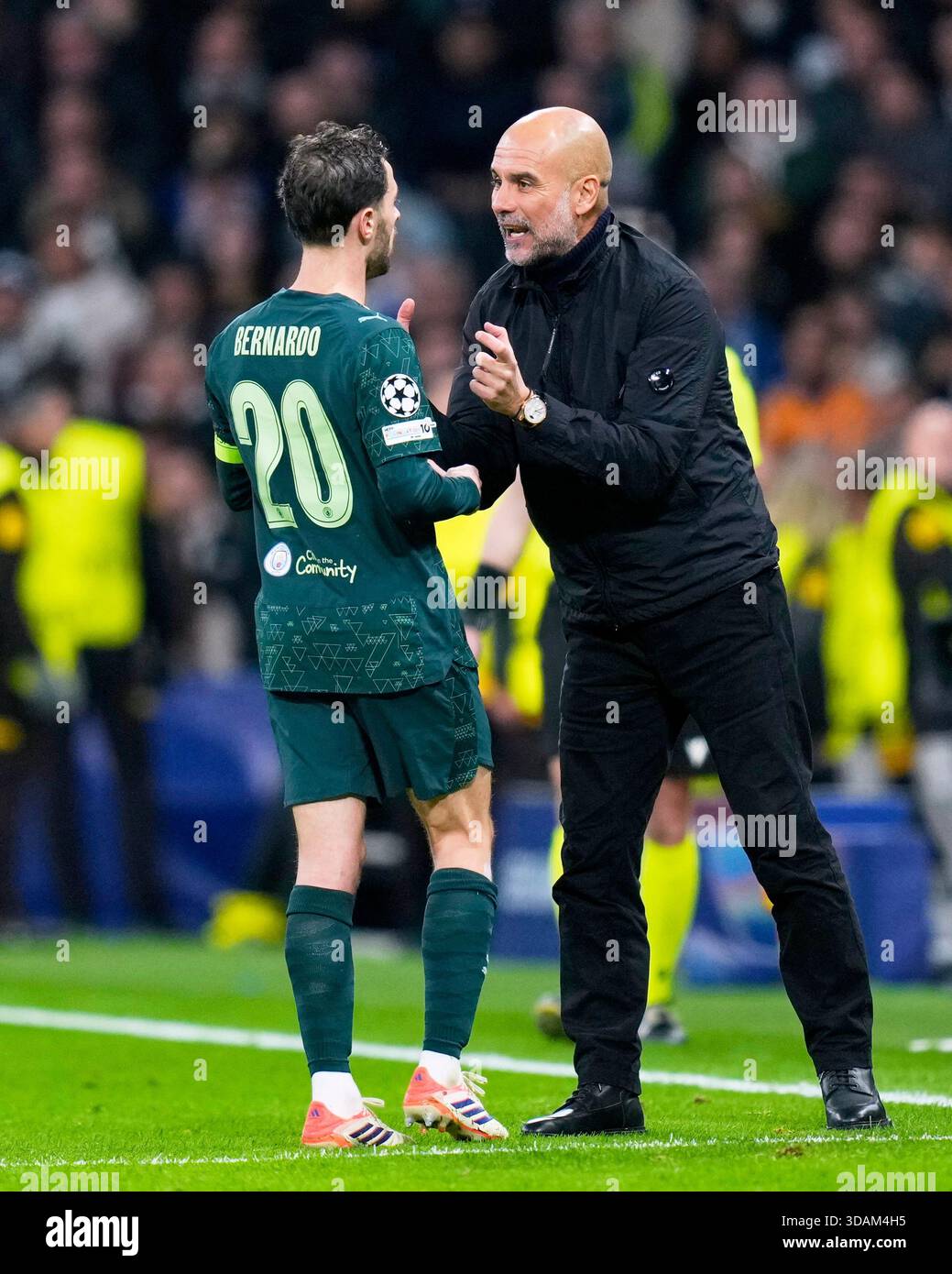 Pep Guardiola head coach of Manchester City FC and Bernardo Silva of ...