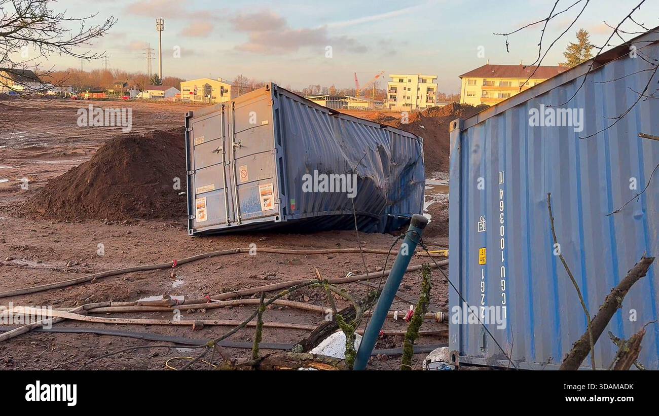 11 December 2025, Hesse, Hanau: View of containers behind which a world ...