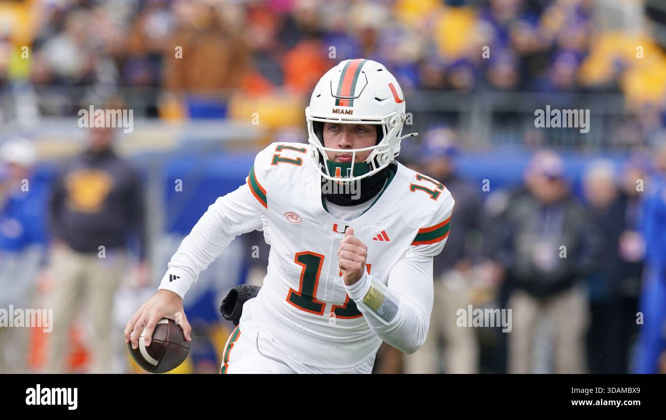 Miami quarterback Carson Beck (11) scrambles during the first half of ...