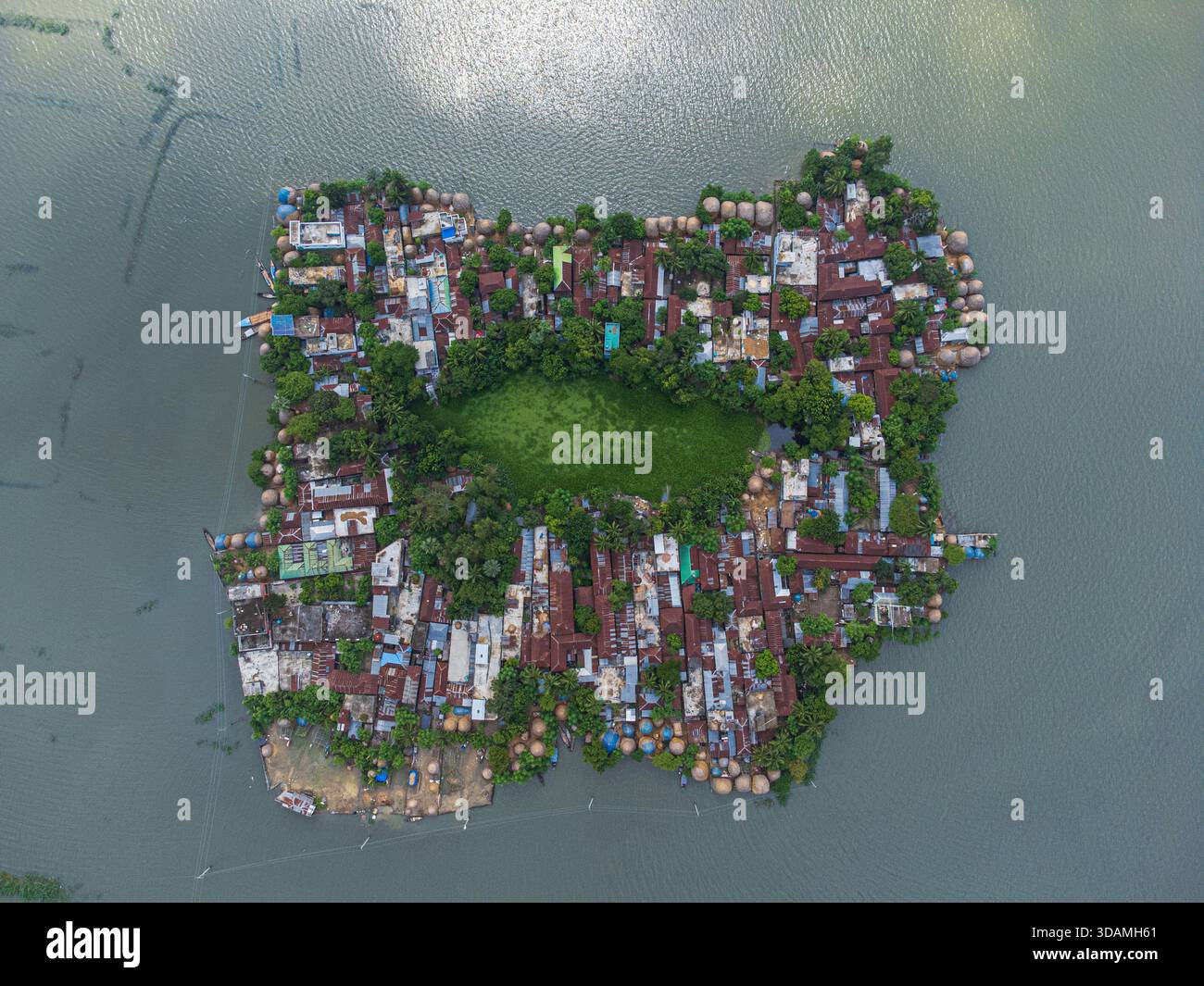 Aerial view of a compact island village with tightly packed houses and ...