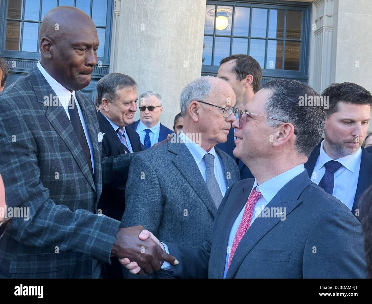 Michael Jordan, left, shakes hands with NASCAR attorney Lawrence ...