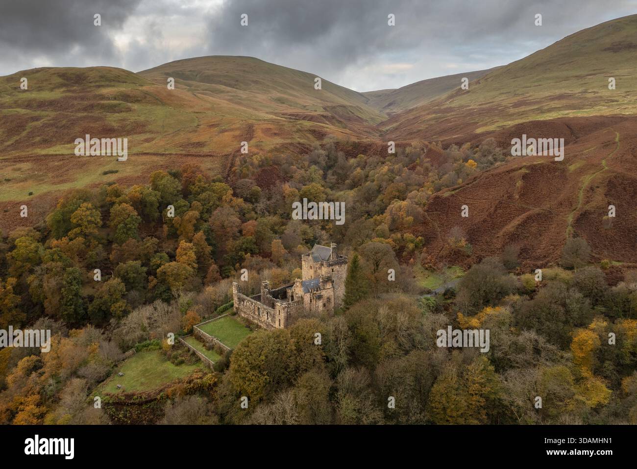 Aerial view of Castle Campbell nestled among the colorful autumn trees ...