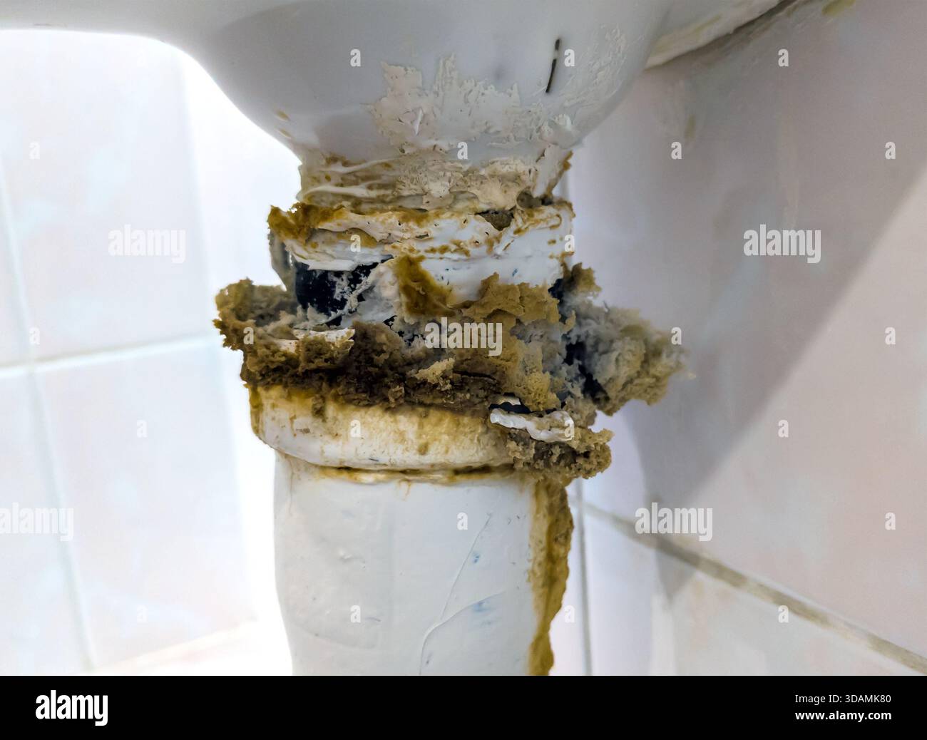 Limescale deposits where the sink drain connection is leaking Stock ...
