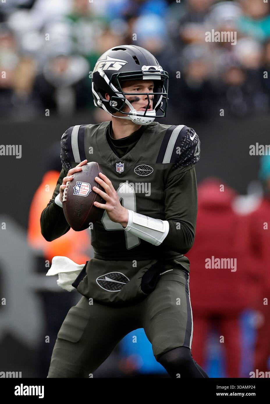 New York Jets quarterback Brady Cook (4) looks to pass the ball during ...