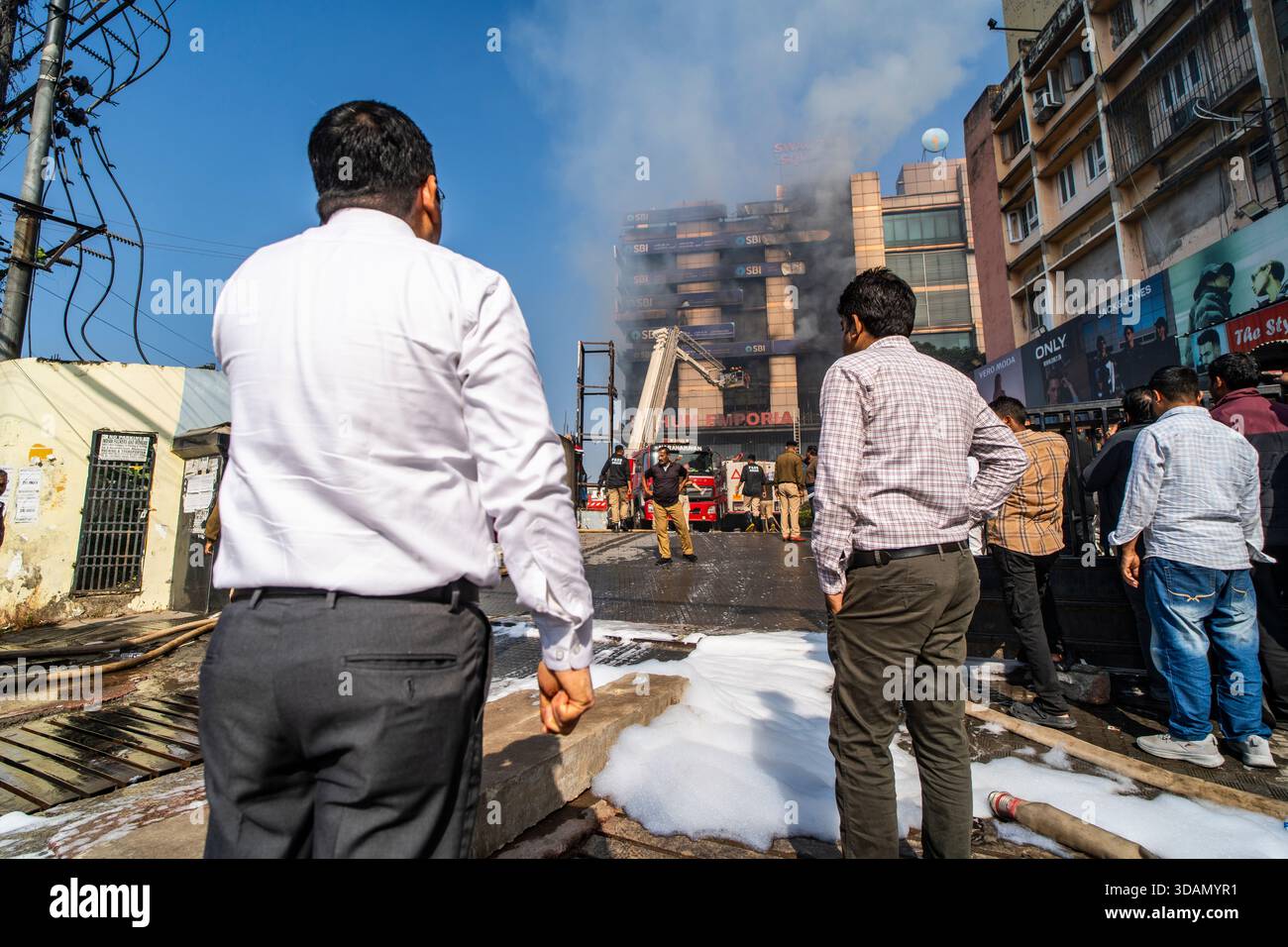 Firefighters work to control a major blaze at a commercial building ...