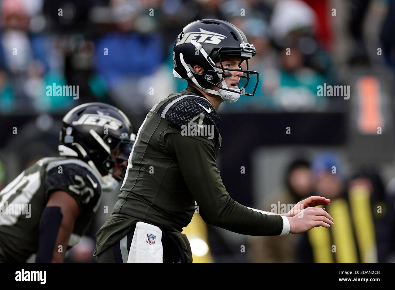 New York Jets quarterback Brady Cook (4) at the line of scrimmage ...