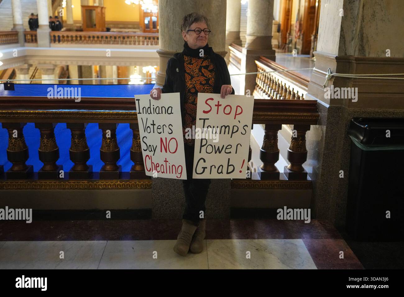 Nancy Kohn, of Indianapolis, hold signs outside the Indiana Senate ...