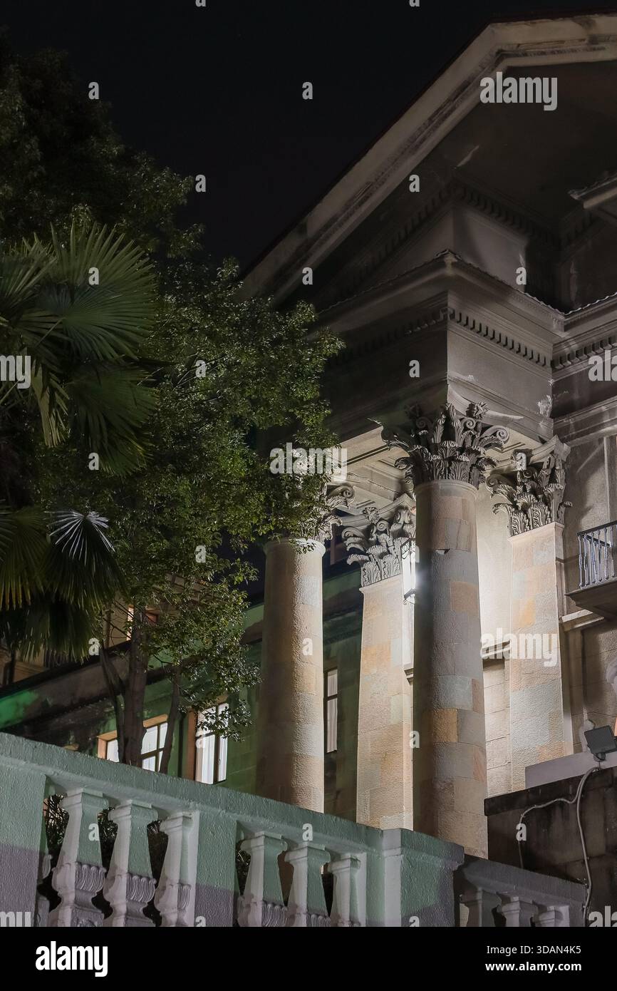 Lower part of grand neoclassical portico at night, Corinthian columns ...